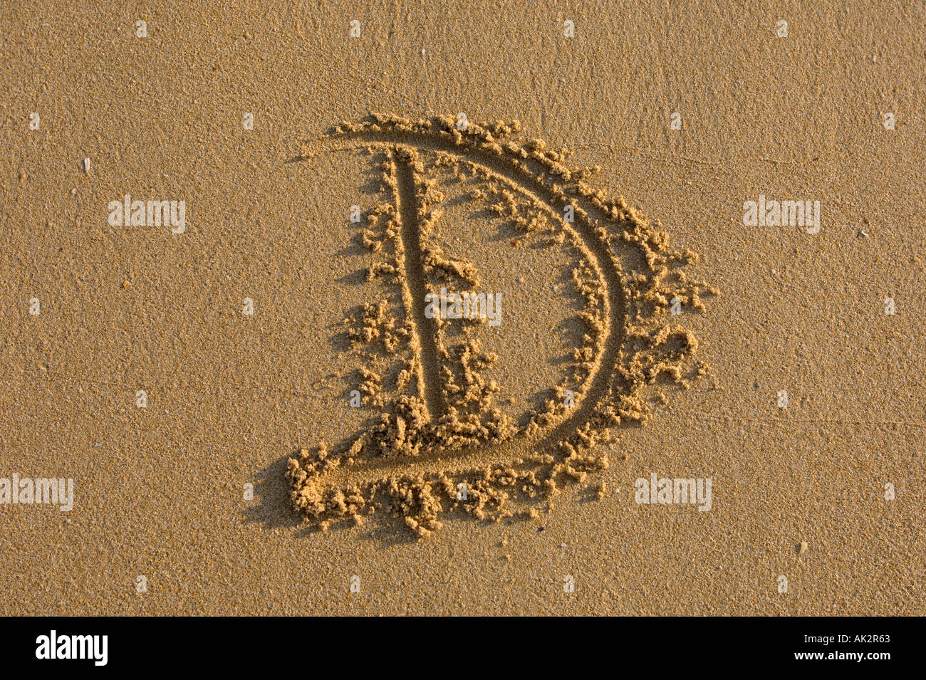 Alphabet writing on sand letter hi-res stock photography and images - Alamy