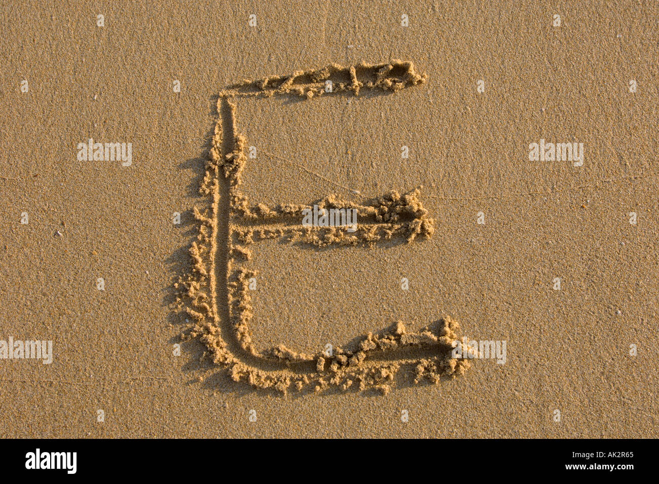 Alphabet hand writing letter on the sand Stock Photo - Alamy