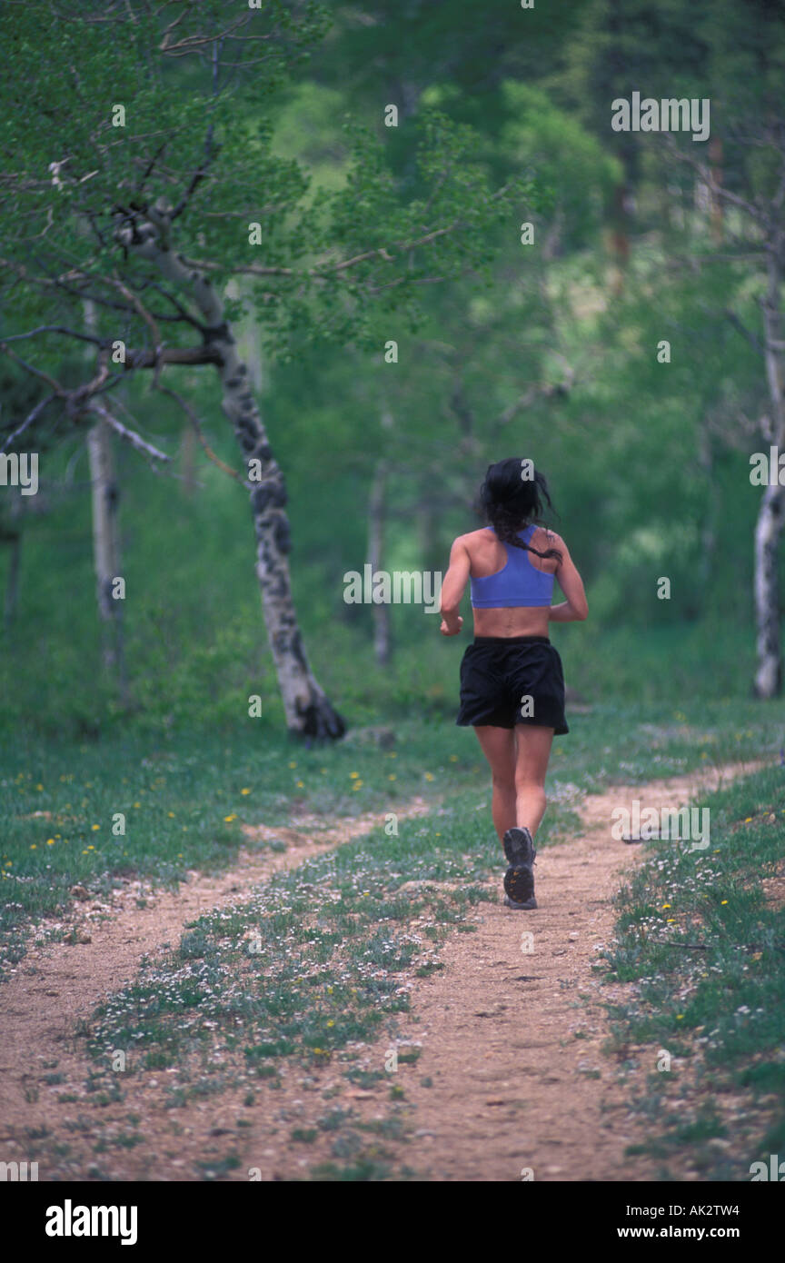 Woman trail running Stock Photo - Alamy