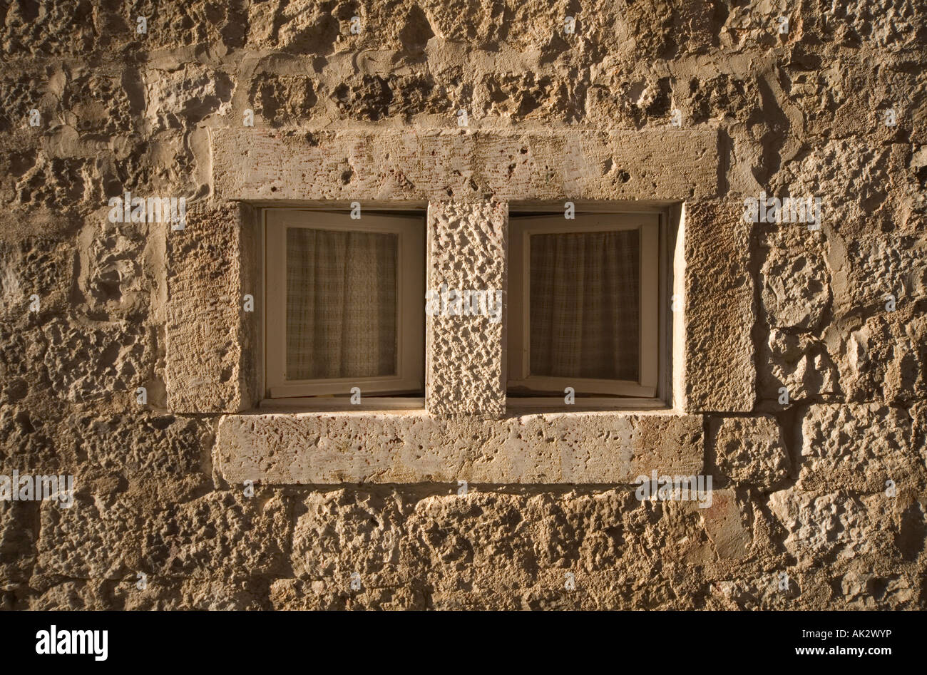 Old stone window wall set in wall hvar croatia Stock Photo - Alamy