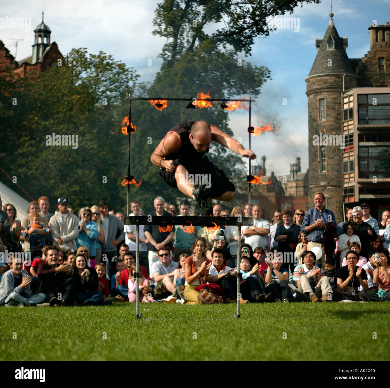 Male street performer on Fringe Sunday entertaing audience leaping ...
