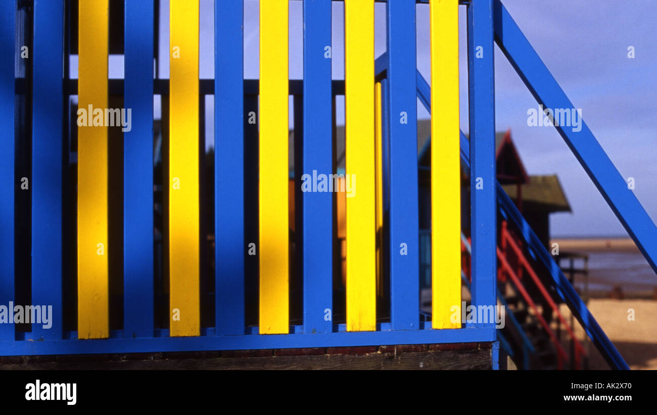 Blue and Yellow Striped Beach Huts Stock Photo - Alamy