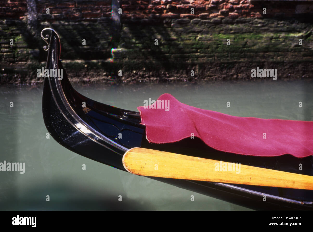 Black gondola in Venice with red cover Stock Photo - Alamy