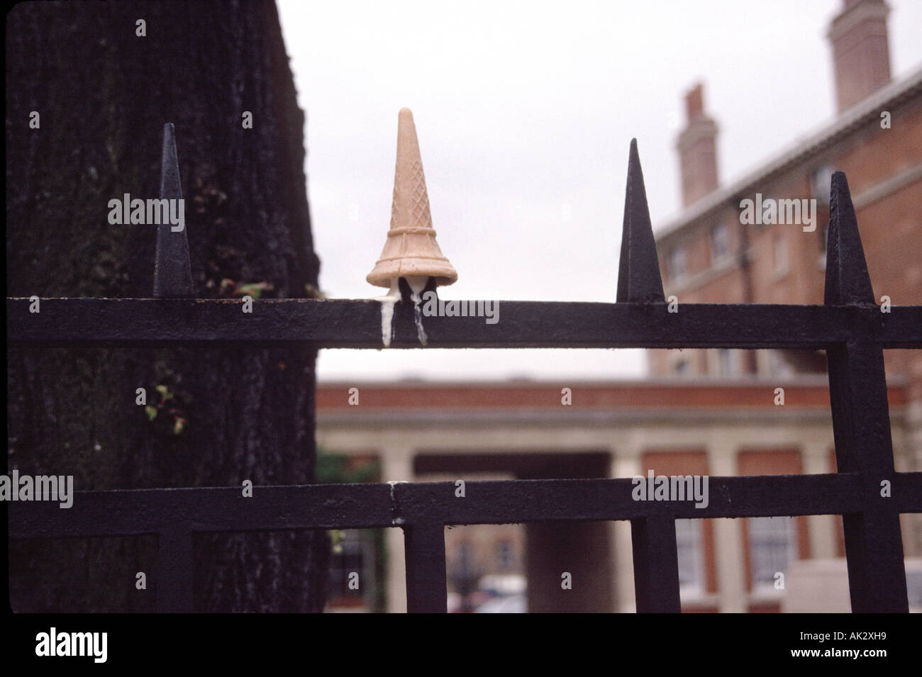 gate with ice cream cone upside down on a spike Stock Photo - Alamy