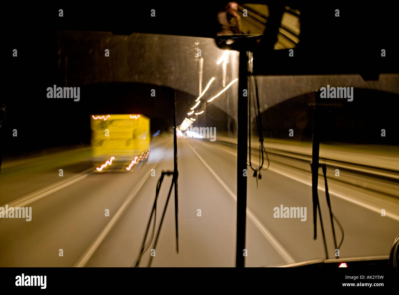 a view through the front of a coach on the m1 motorway traveling home ...