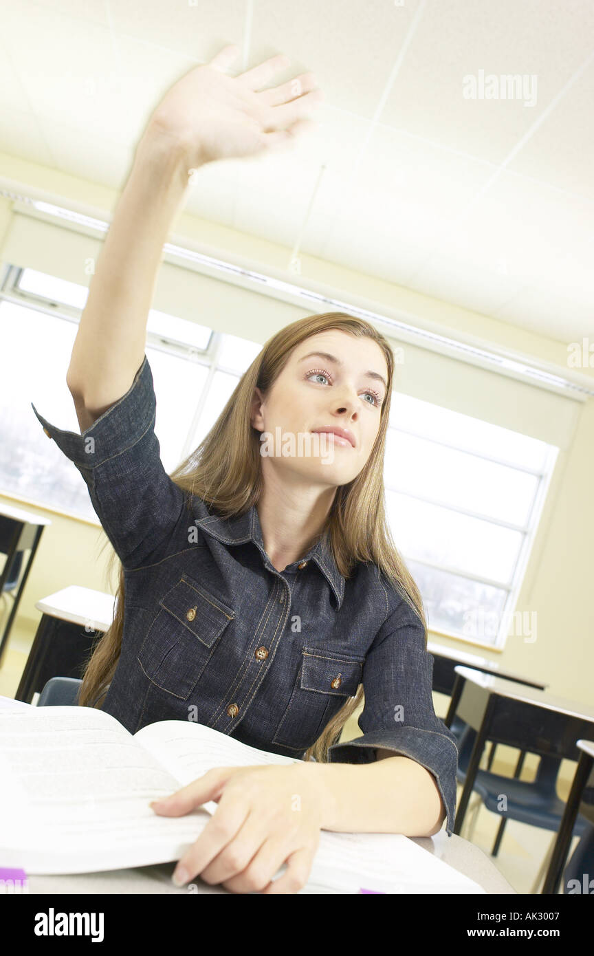 High school girl raising hand hi-res stock photography and images - Alamy