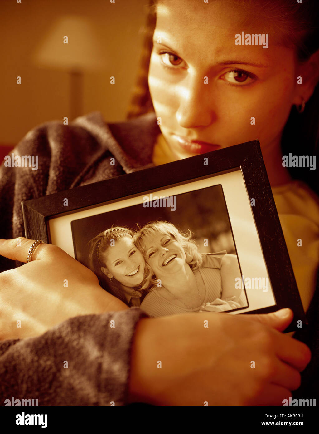 Girl experiencing loss over the death of her mother Stock Photo - Alamy