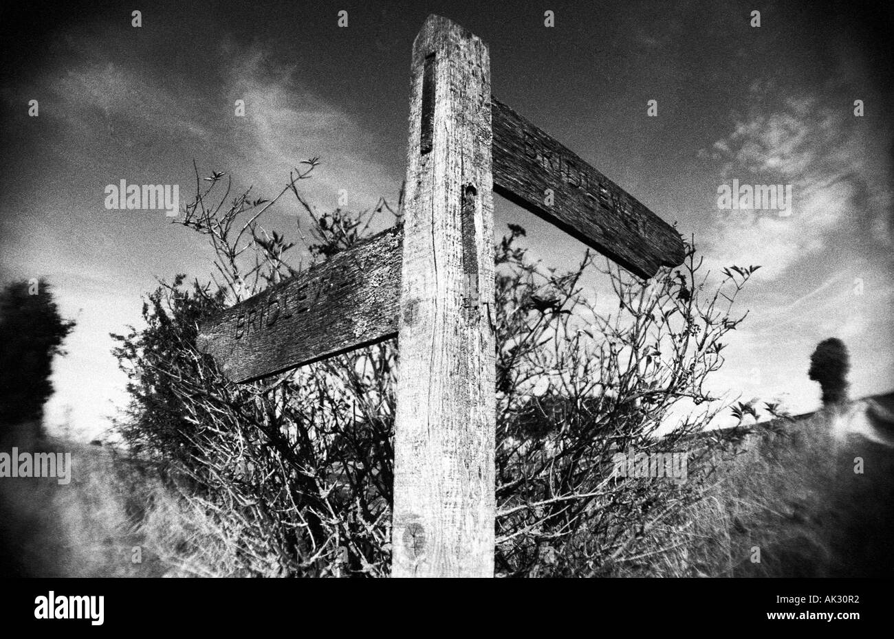 A dramatic image of a signpost pointing to distant objects Stock Photo ...