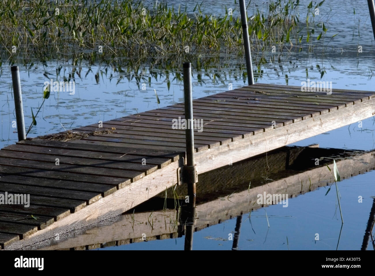 Wood dock sinking in water hi-res stock photography and images - Alamy