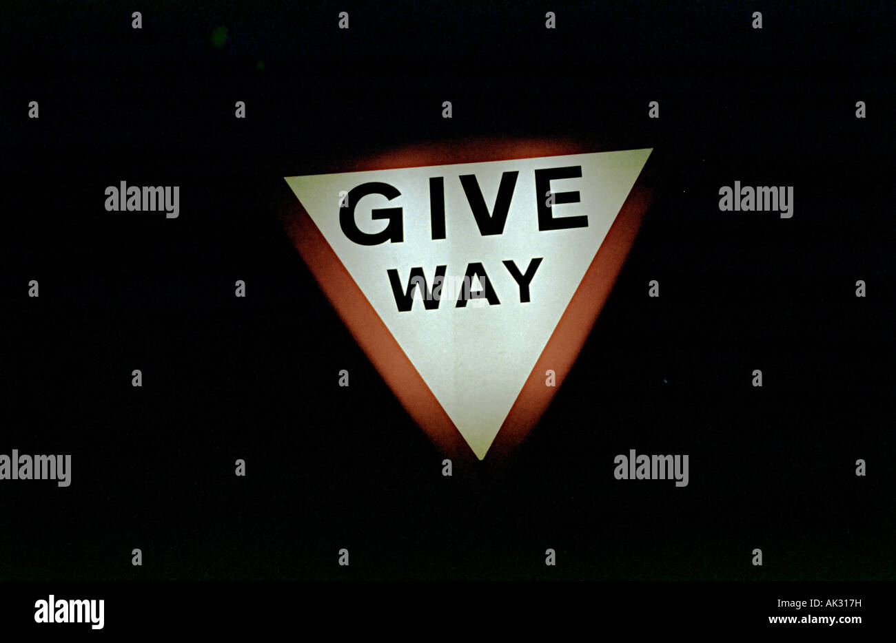 a give way illuminated sign in the uk england Stock Photo - Alamy