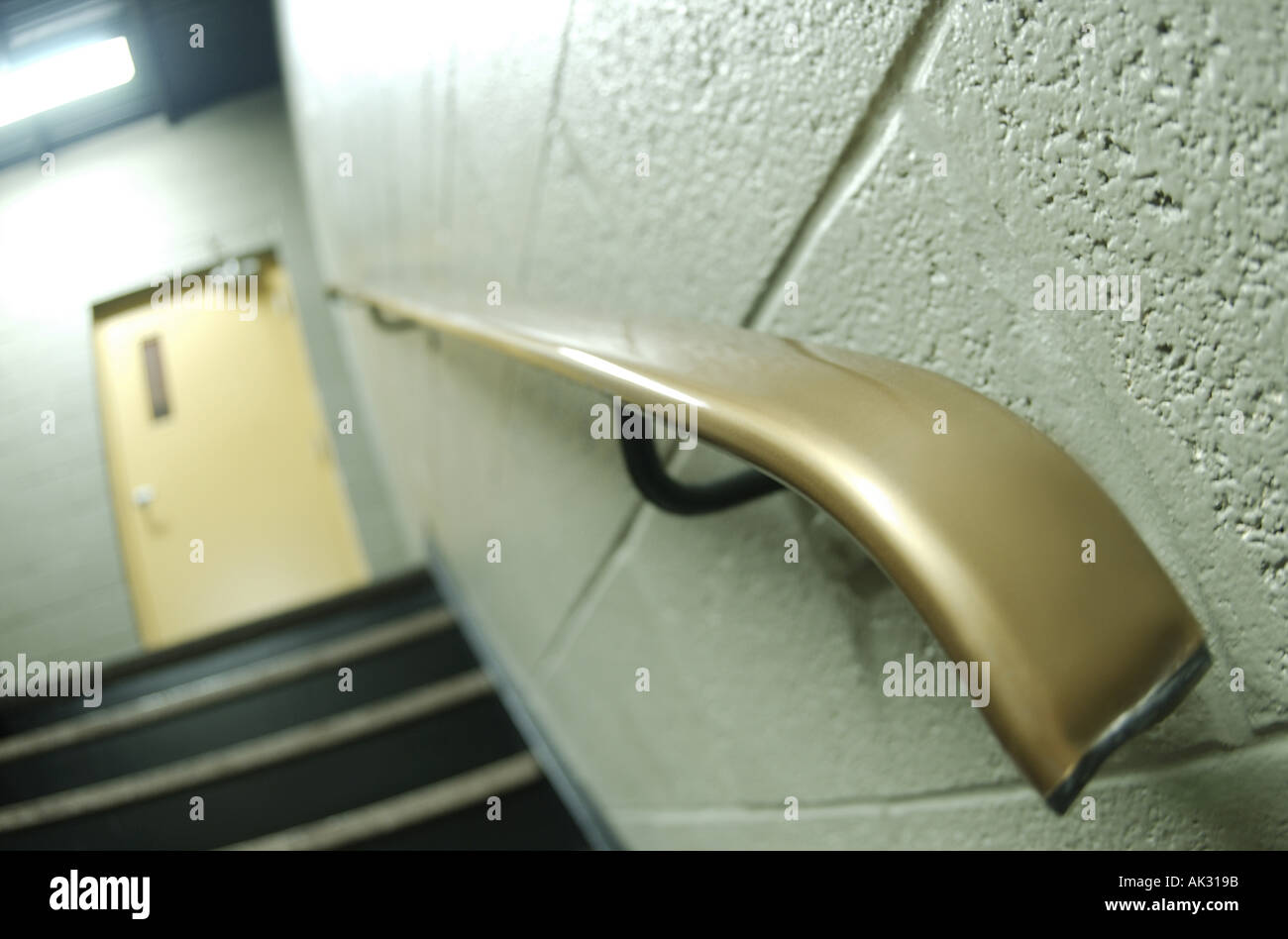 Metal railing on white concrete wall Stock Photo - Alamy