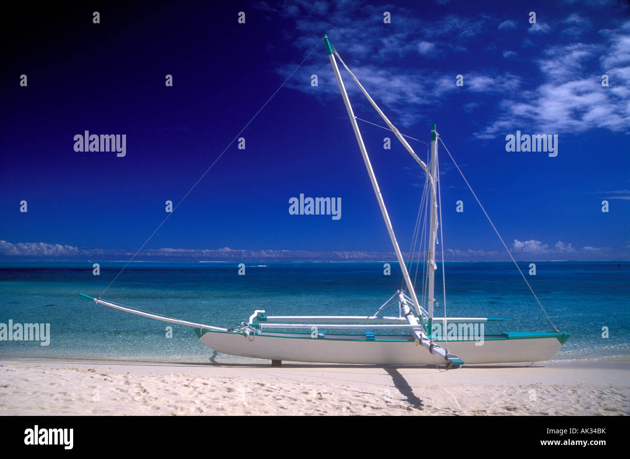 Outrigger sailing boat on beach, Bora Bora Stock Photo - Alamy