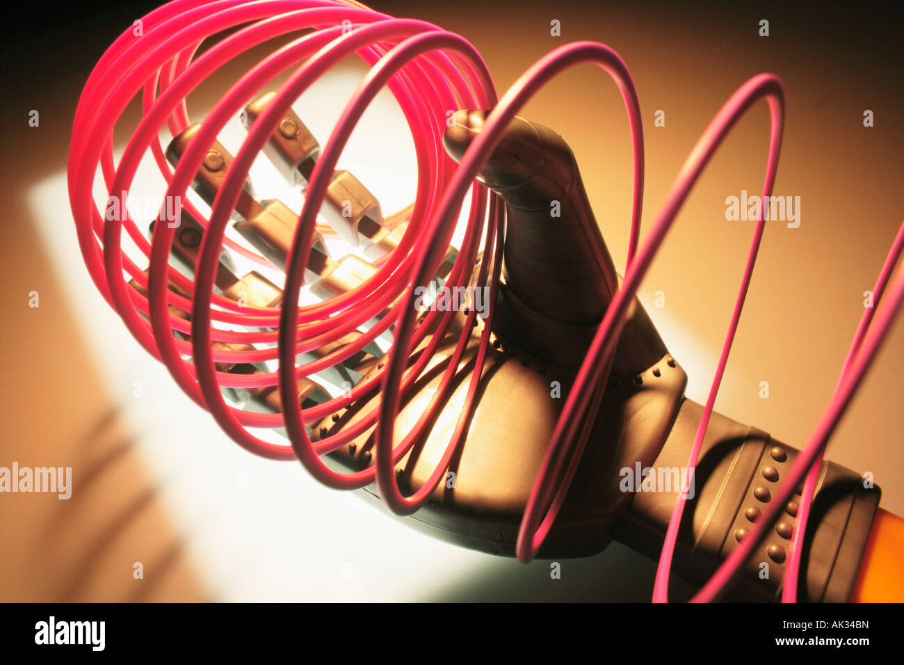 Robot Hand with Coil Spring Toy Stock Photo - Alamy