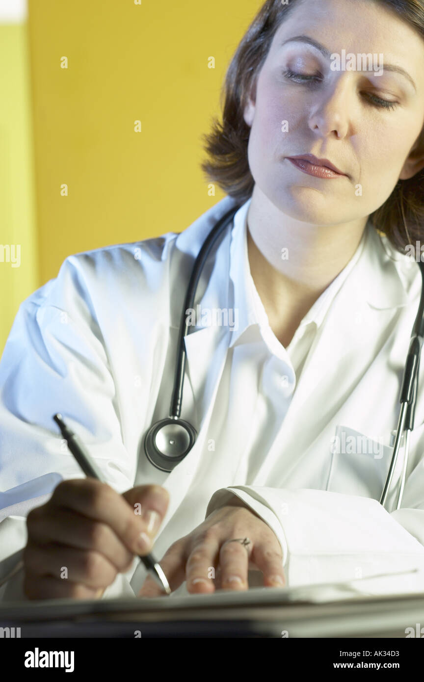 Doctor working at her desk Stock Photo - Alamy