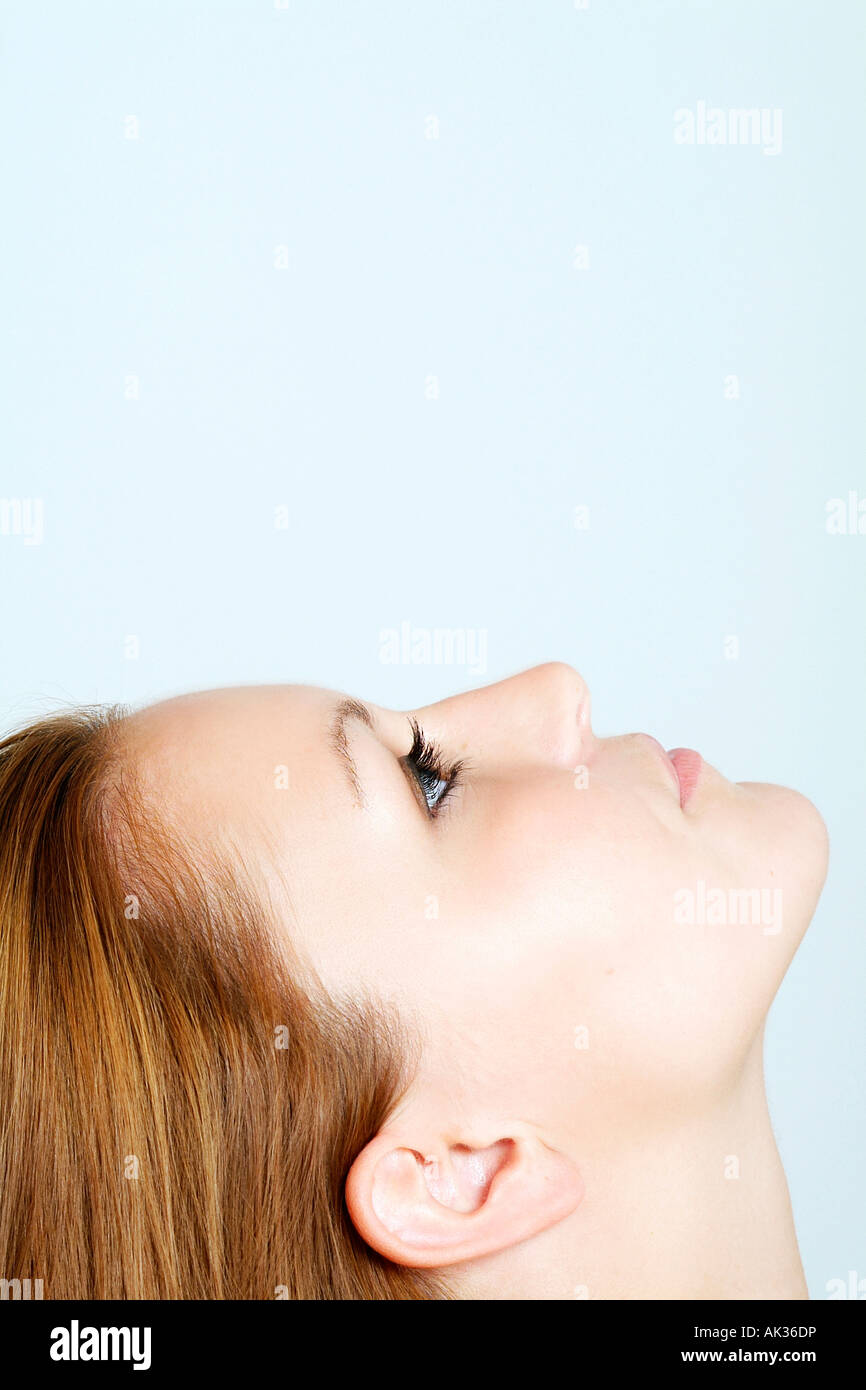 Young woman looking up Stock Photo - Alamy