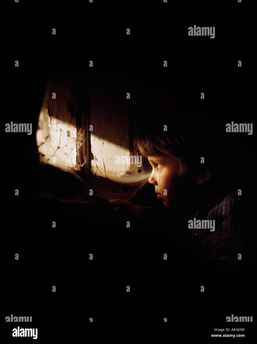 Girl looking out window and crying Stock Photo - Alamy