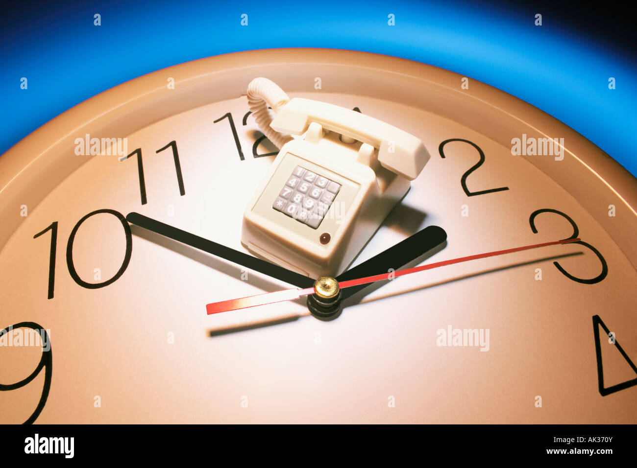 Miniature Telephone on Clock Stock Photo - Alamy