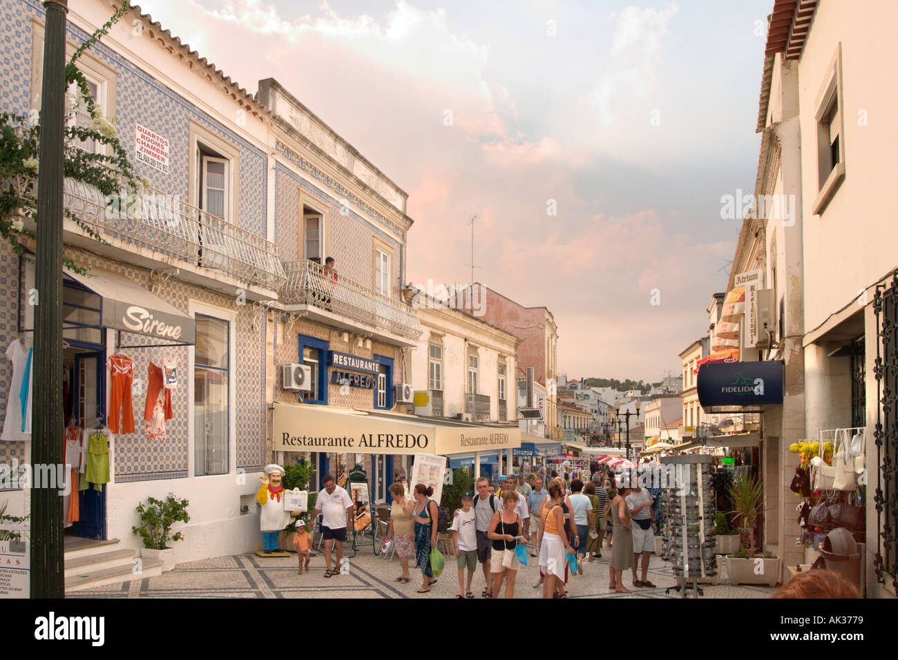 Shops in the resort centre in the early evening, Albufeira, Algarve ...