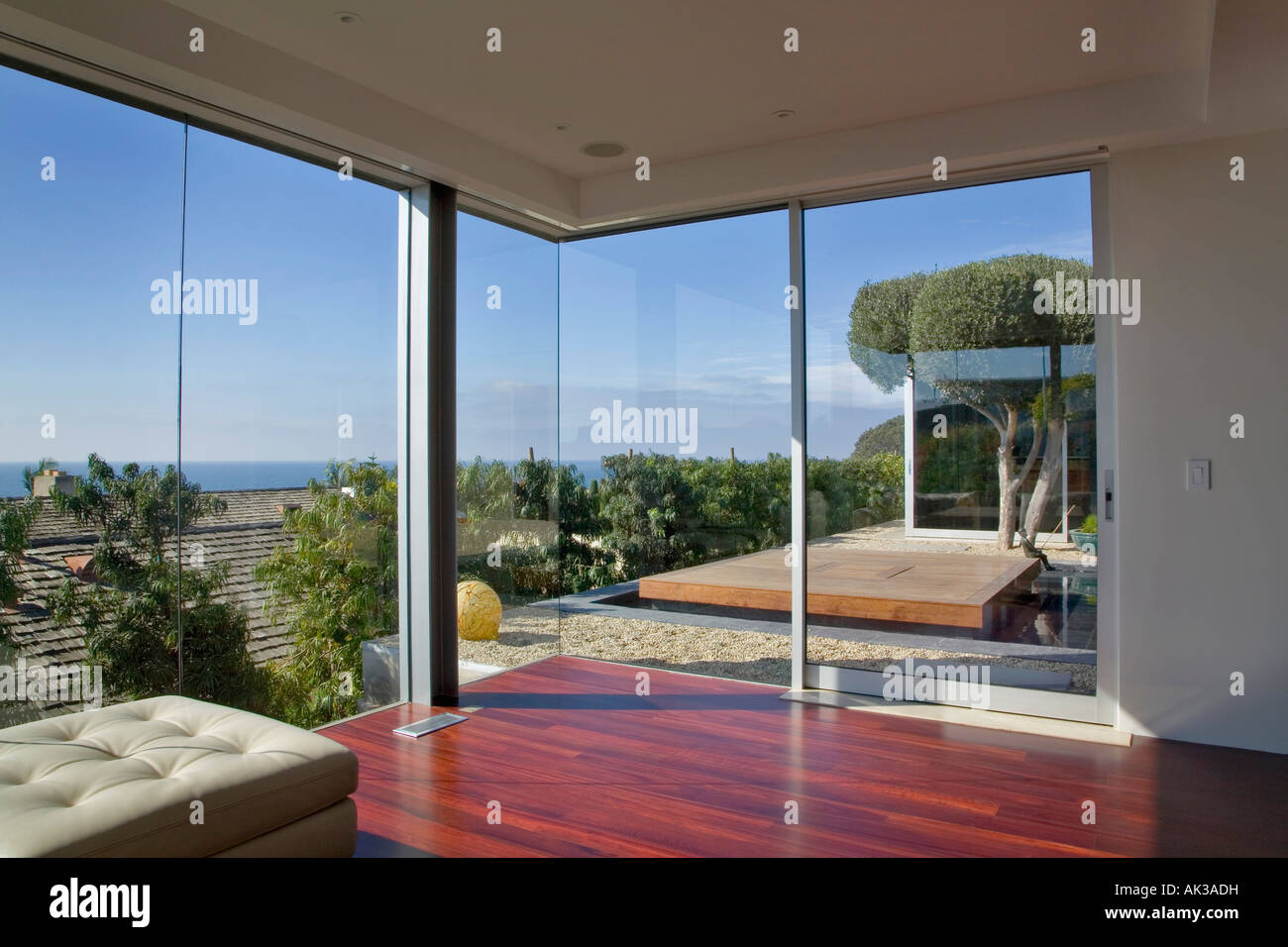 Modern Living Room with Large Windows Stock Photo - Alamy