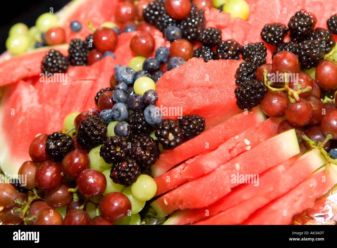 mixed fruit plate with berries Stock Photo - Alamy