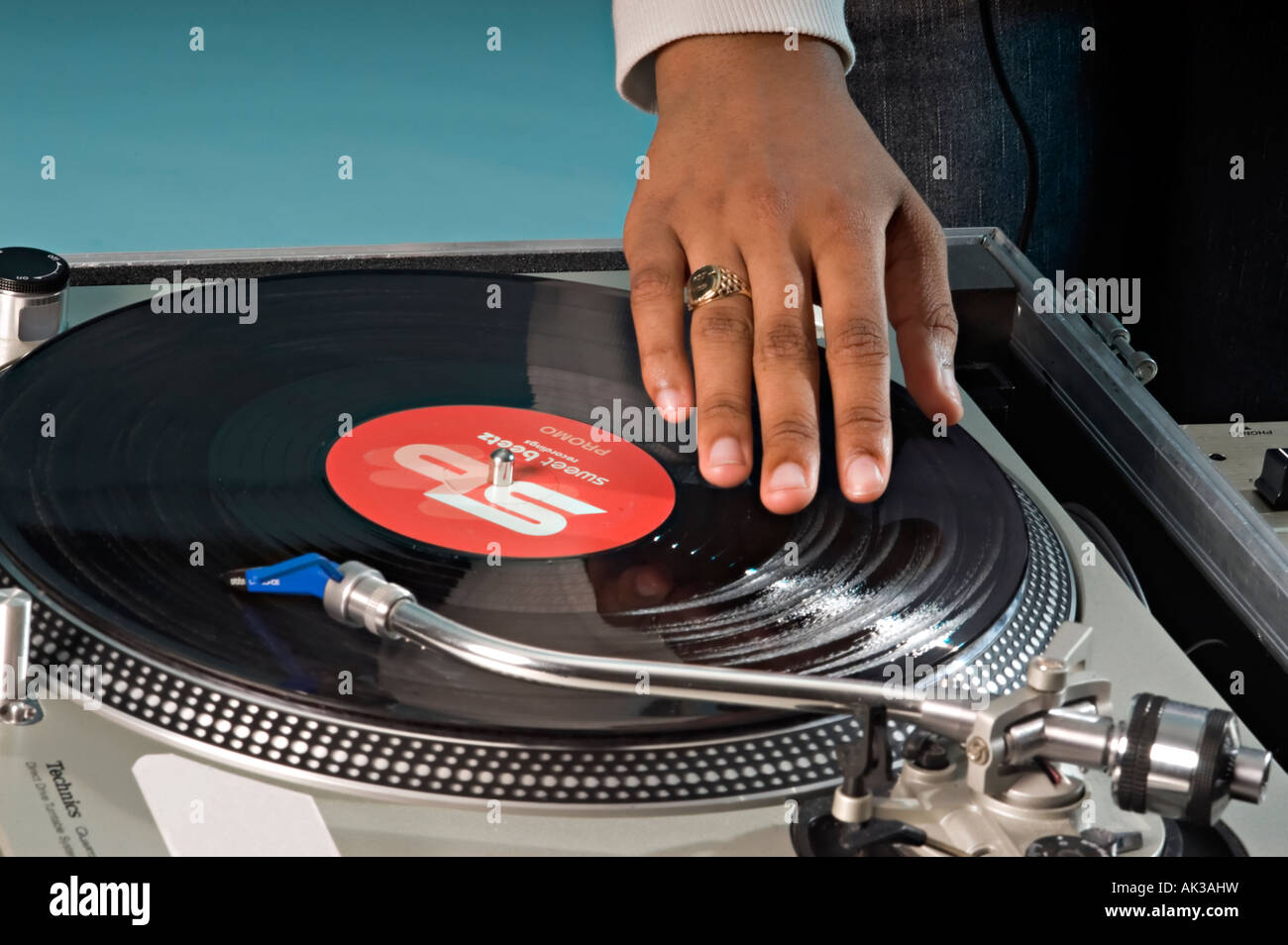 a dj mixing records on some decks Stock Photo - Alamy