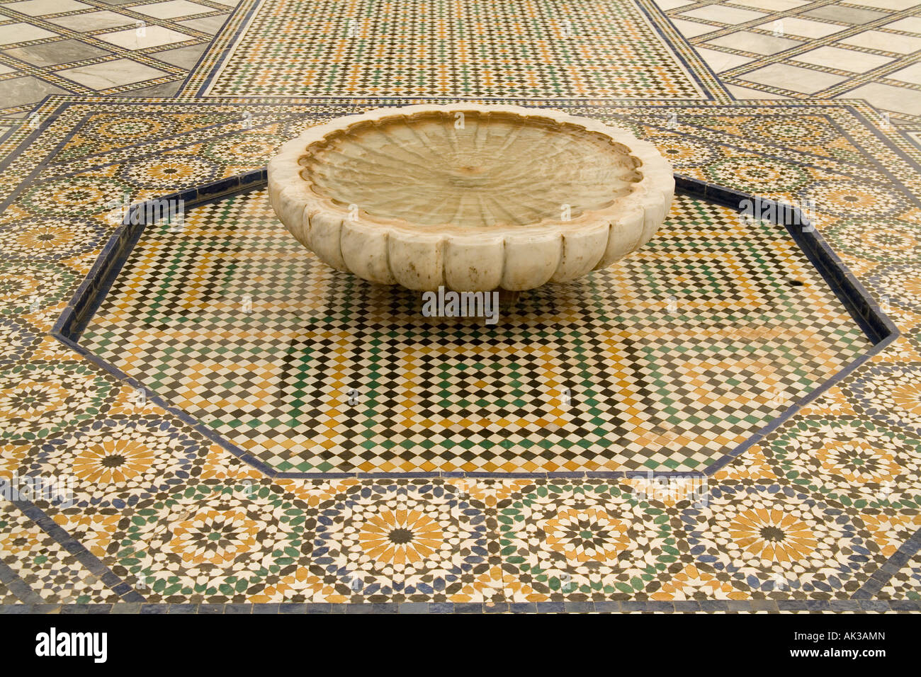 Moroccan marble fountain in the courtyard of Musee de Marrakesh which ...