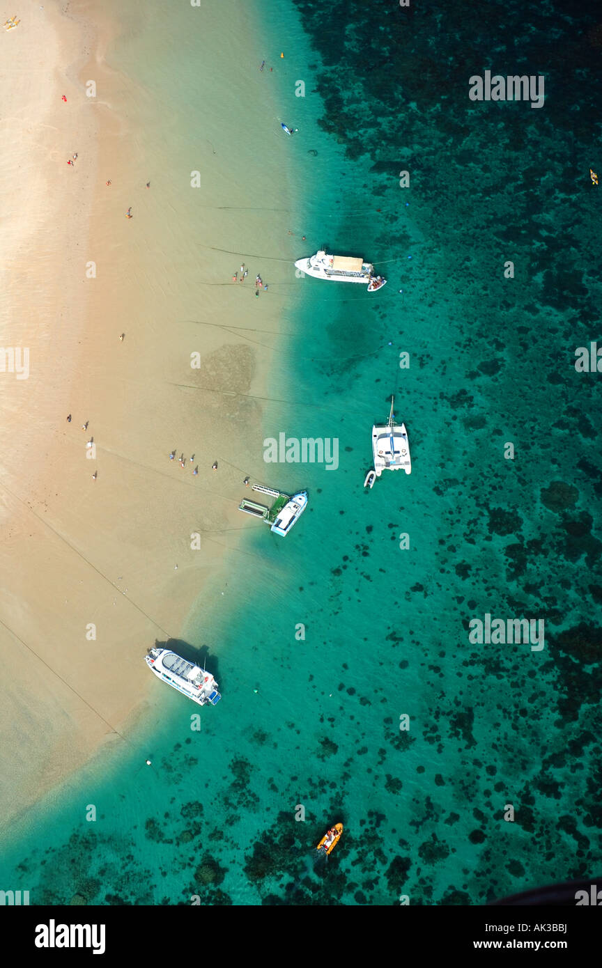 Boats and people and reefs and beach of Coral Bay Ningaloo Reef Marine ...
