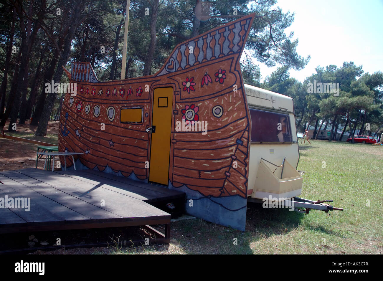 Pirate ship caravan with decking in summer campsite on the coast near ...