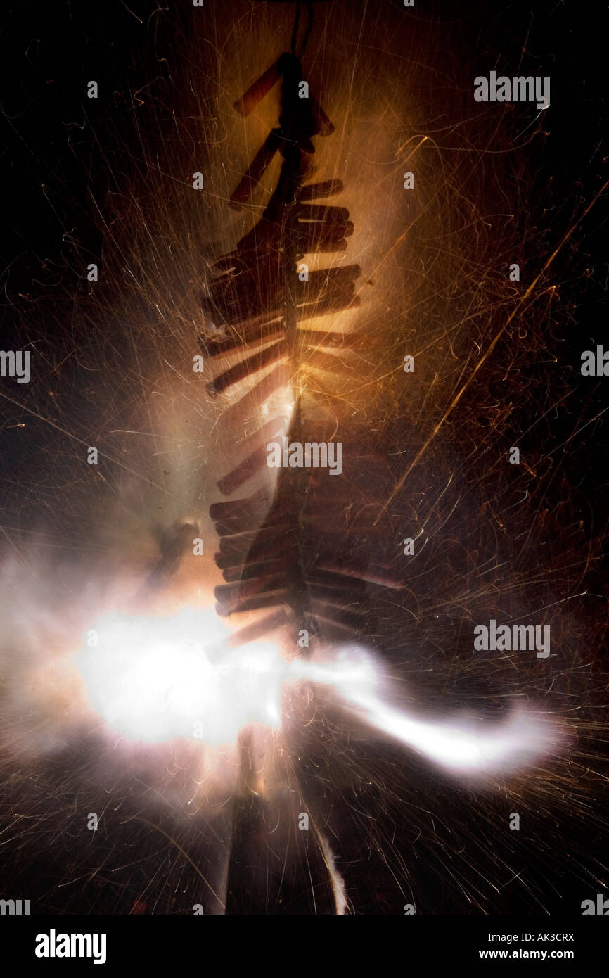 Line of exploding firecrackers at night in India during Diwali festival ...