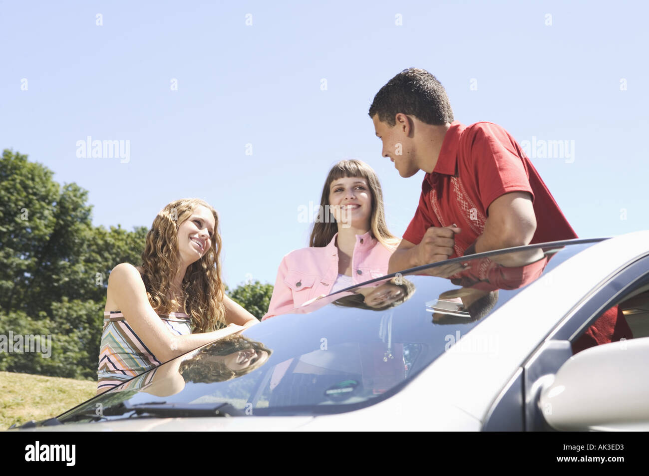 Three teenage friends hanging out Stock Photo - Alamy