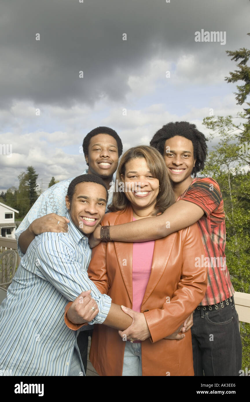 A mother with her three grown sons Stock Photo - Alamy