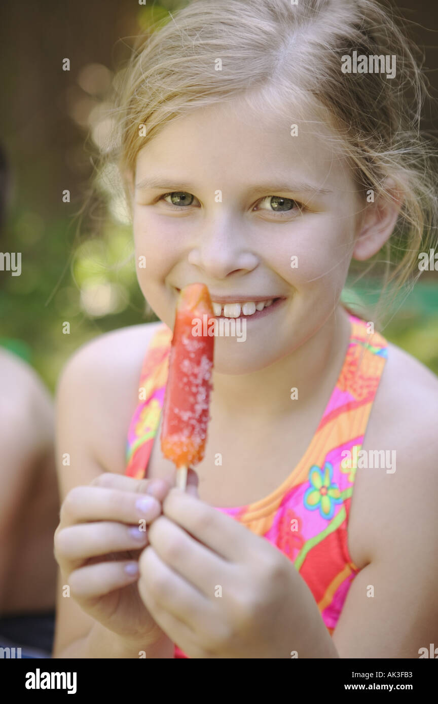 A young girl holding a popsicle Stock Photo - Alamy
