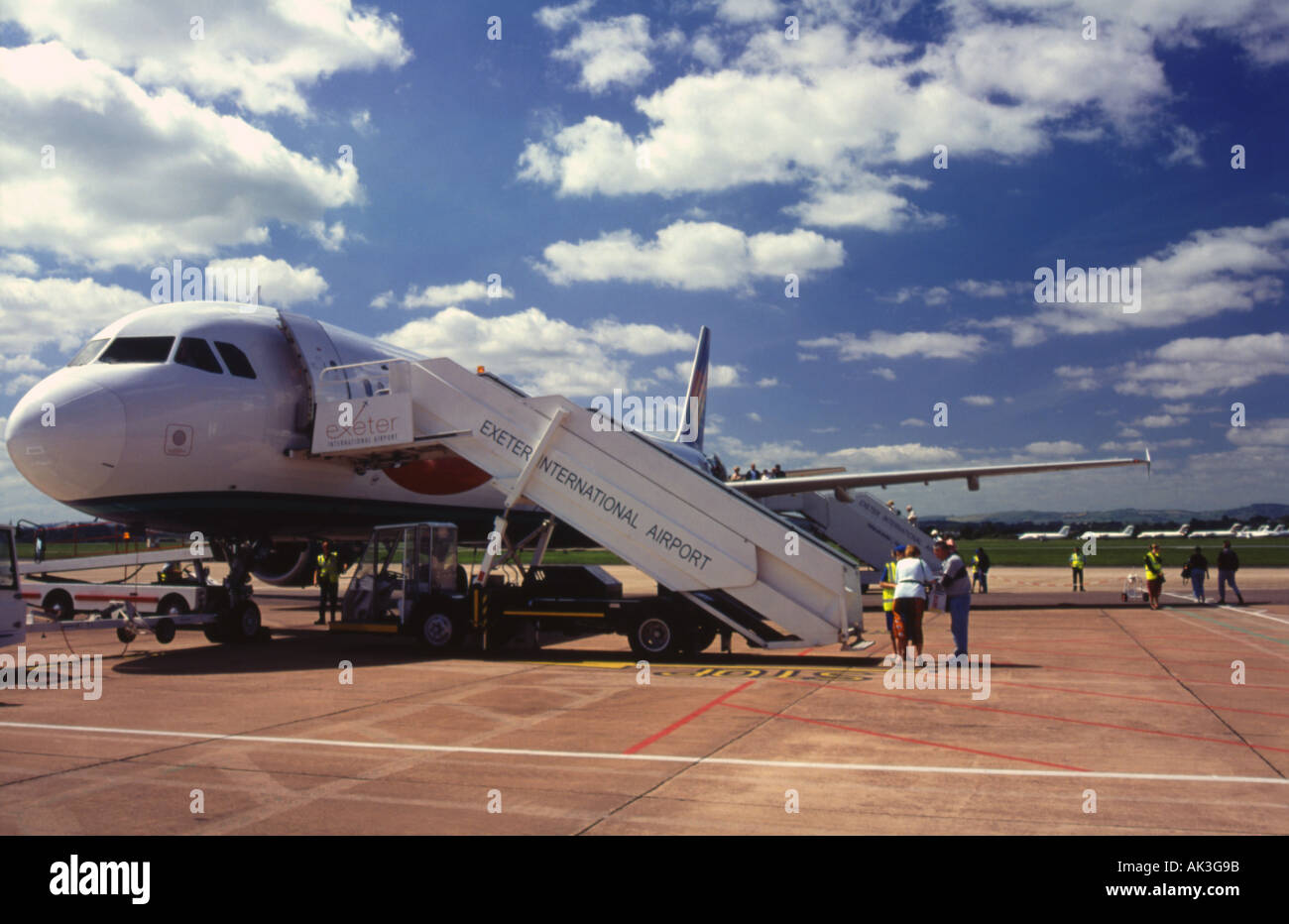 Passengers boarding a jet plane at Exeter International Airport Devon ...