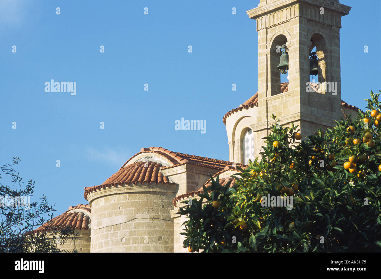The Greek Orthodox Church of Panagia Theoskepasti flanked by an Orange ...