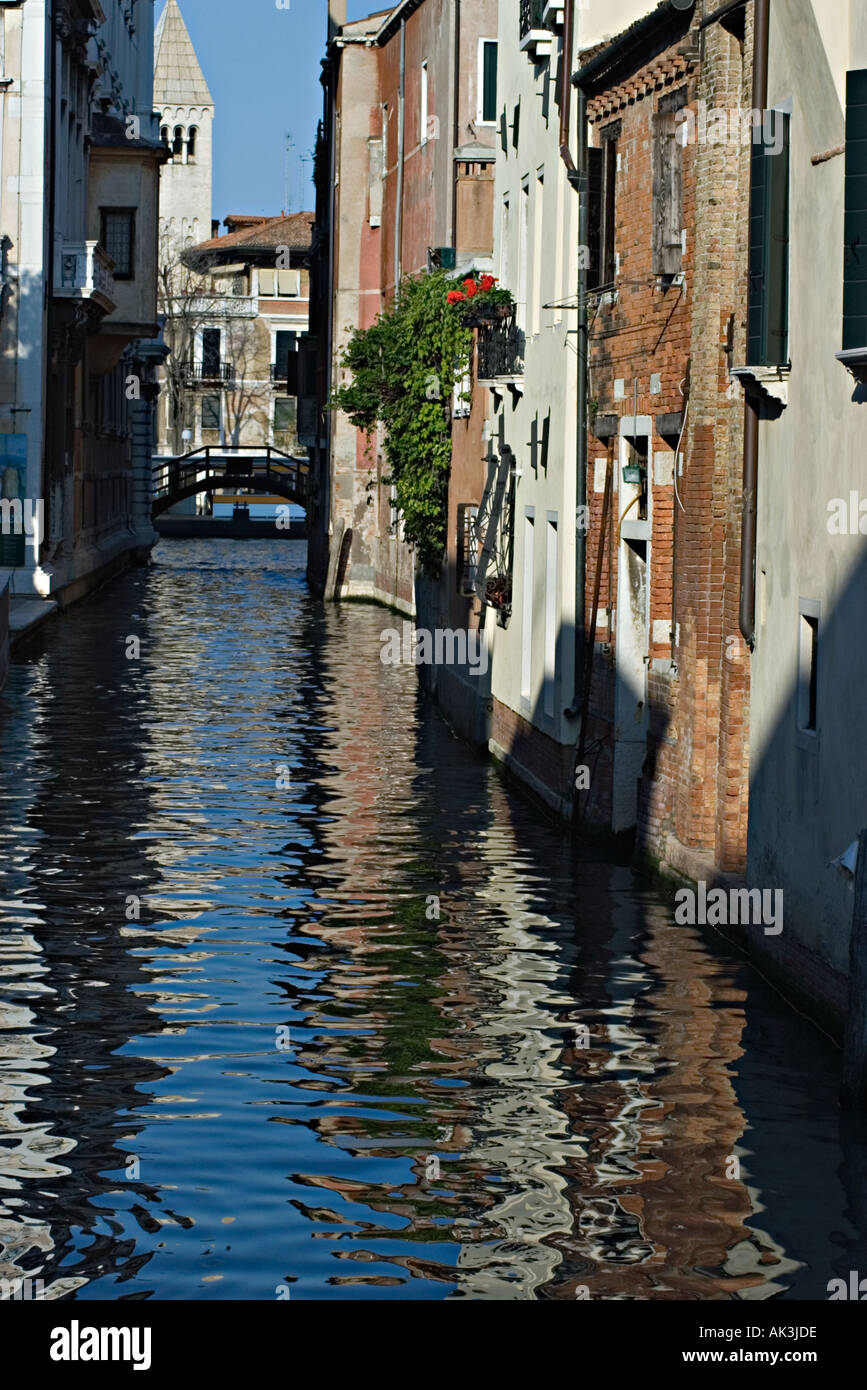 Canal scene in Venice with old houses and reflections in the water ...