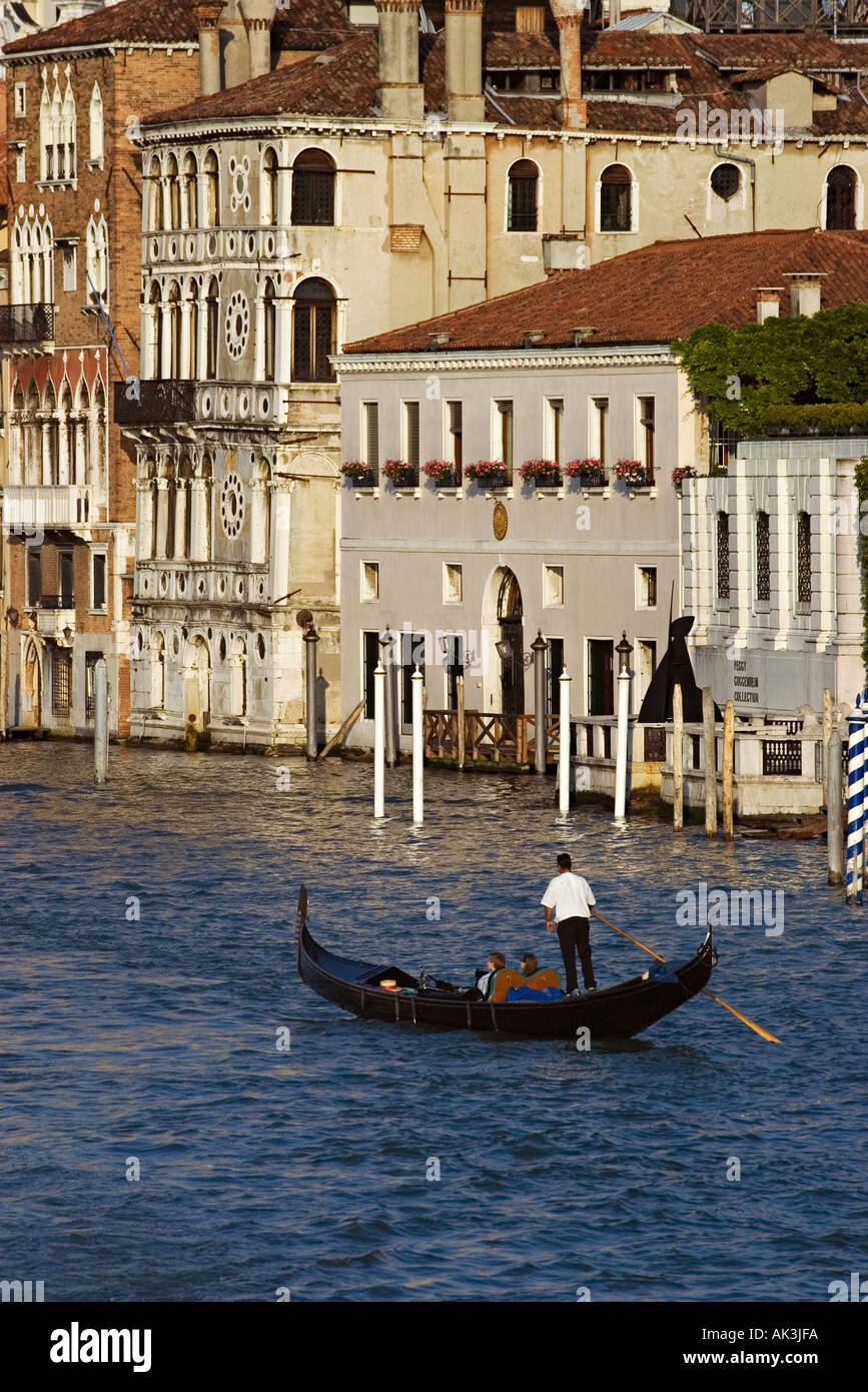 Old buildings and palazzos along the Grand Canal Venice with gondola ...