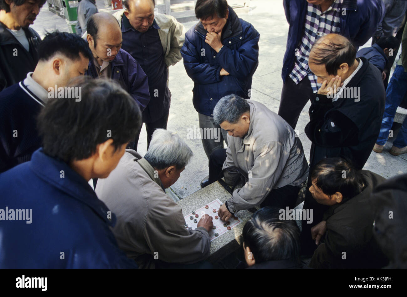Chinese men playing a traditional board game in Mongkok Hong Kong China ...