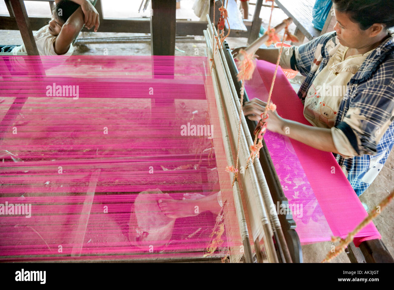 Woman weaving silk on a hand loom Mekong Island Phnom Penh Cambodia ...