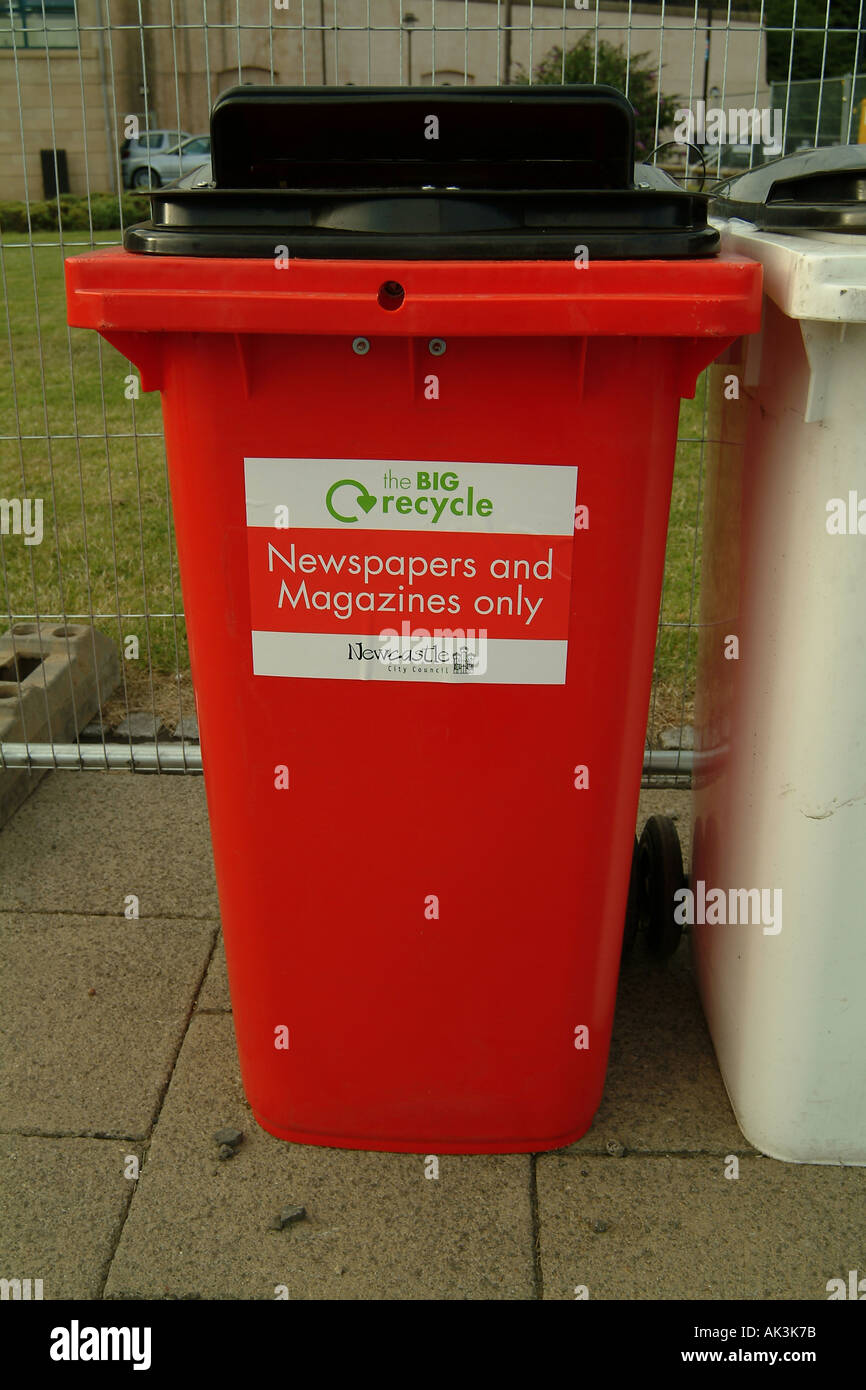 Newspaper and magazine waste paper recycling wheelie bin Stock Photo ...