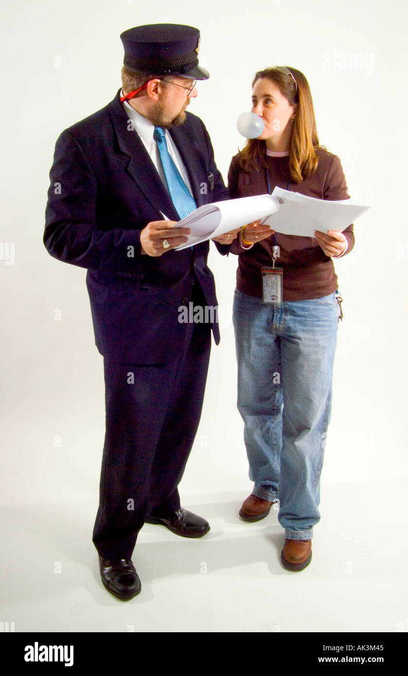 In a humorous reversal of roles a woman railroad engineer blows bubble ...