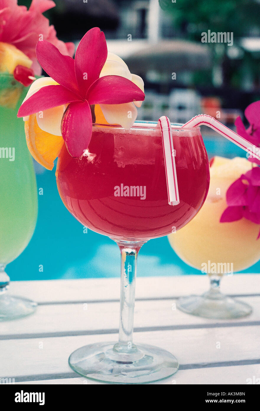 Fiji. Hotel poolside terrace. Outdoor still life of tropical cocktails ...