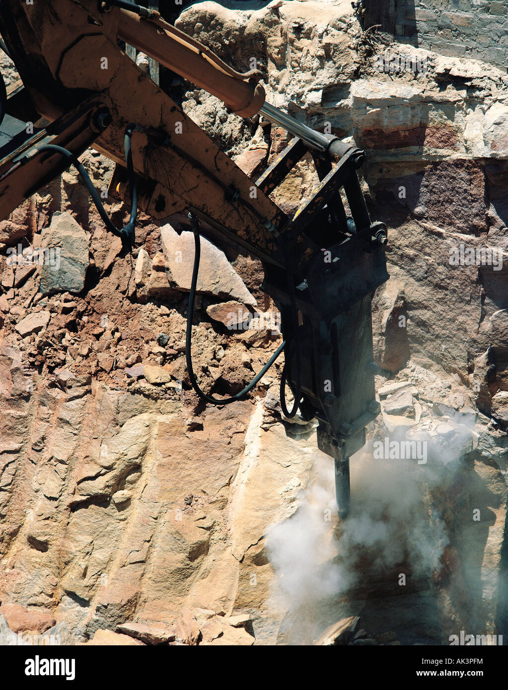 Industry. Construction site excavation. Hammer Drill breaking up ...