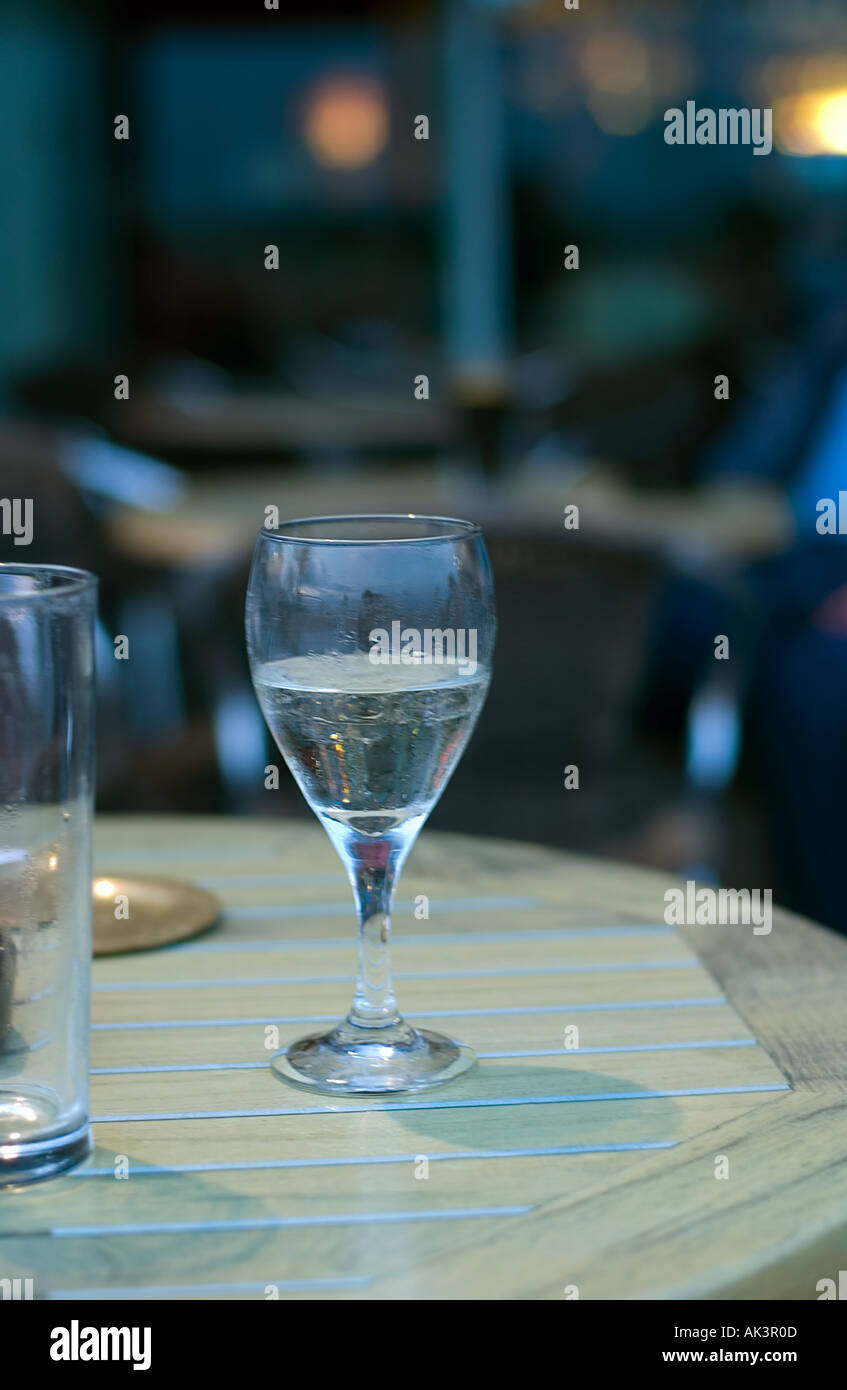 Glass of water on a cafe table Stock Photo - Alamy