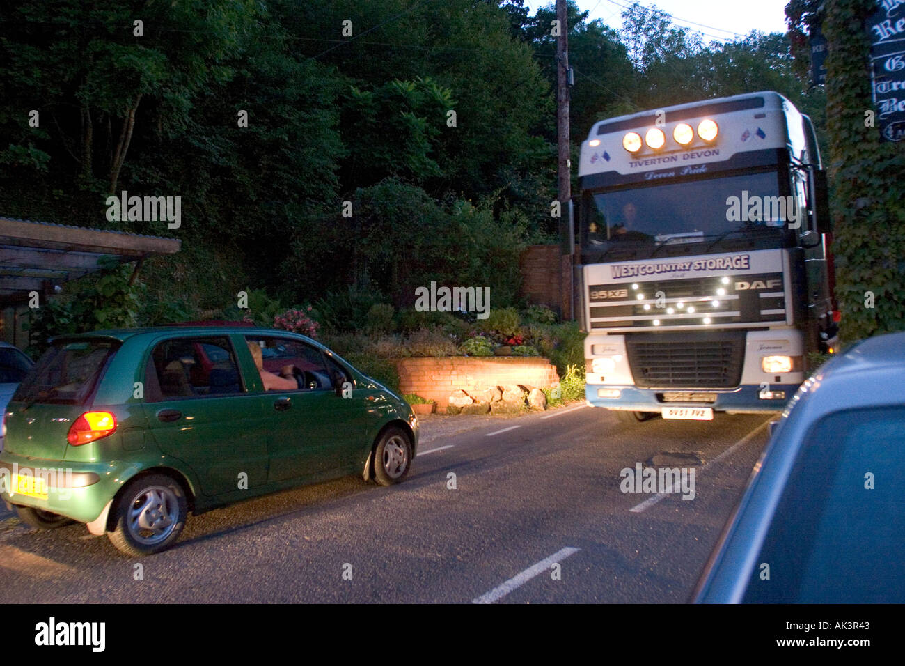 Articulated lorry blocking country lane at night Stock Photo - Alamy
