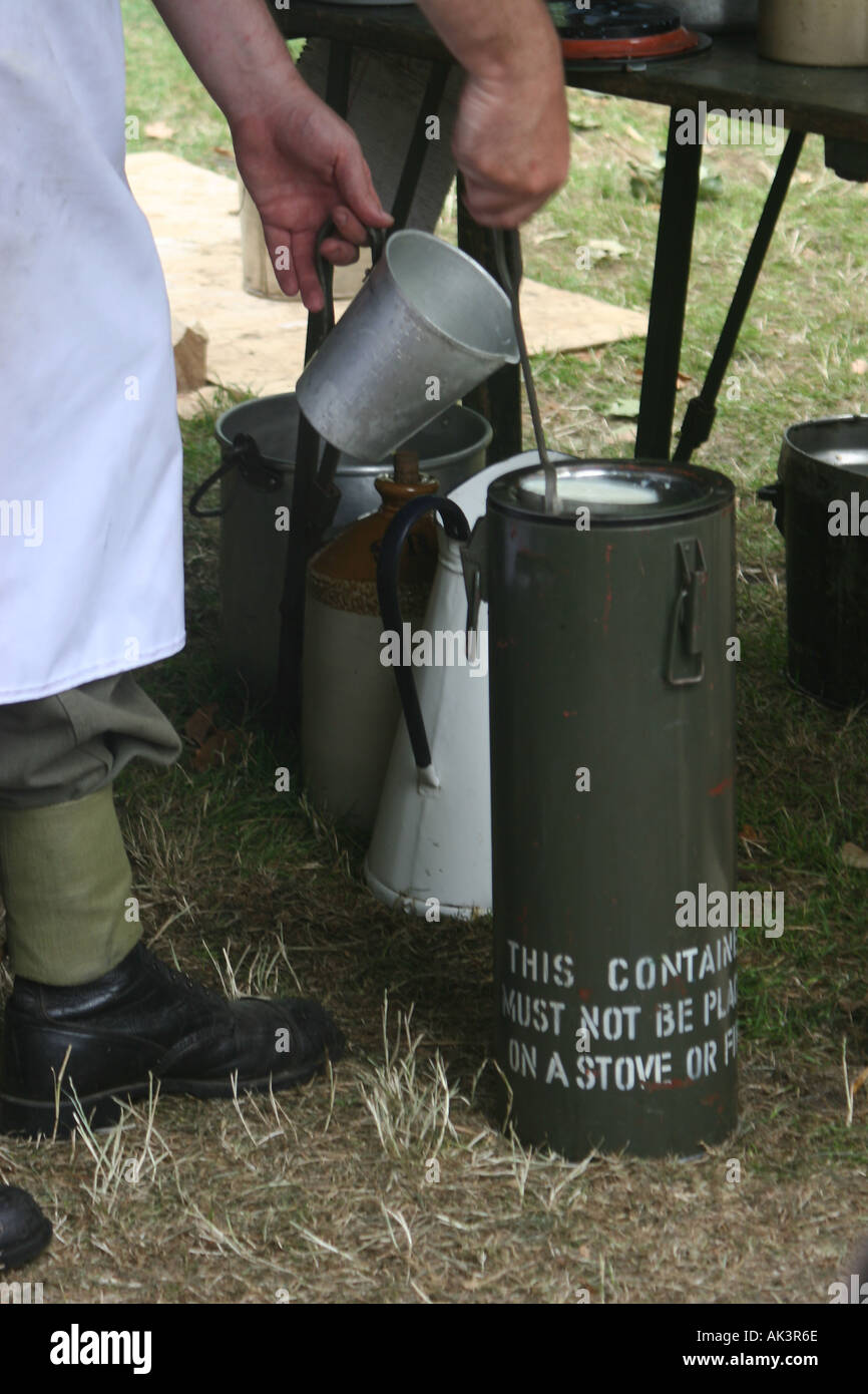 British World War Two re enactor preparing food in the kitchen at an ...