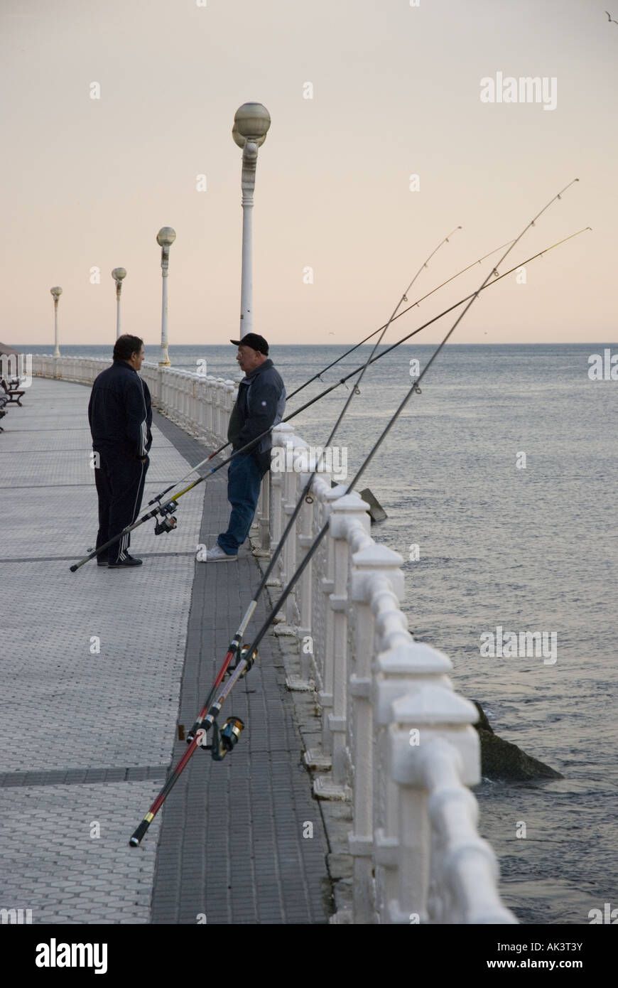 Two fishermen at dawn in San Sebastian on Spain's Basque Coast Stock ...