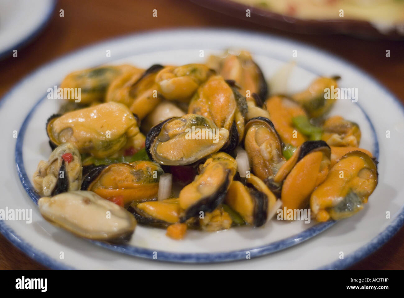 A plate of mussels served in a pintxos, or tapas, bar in San Sebastian ...