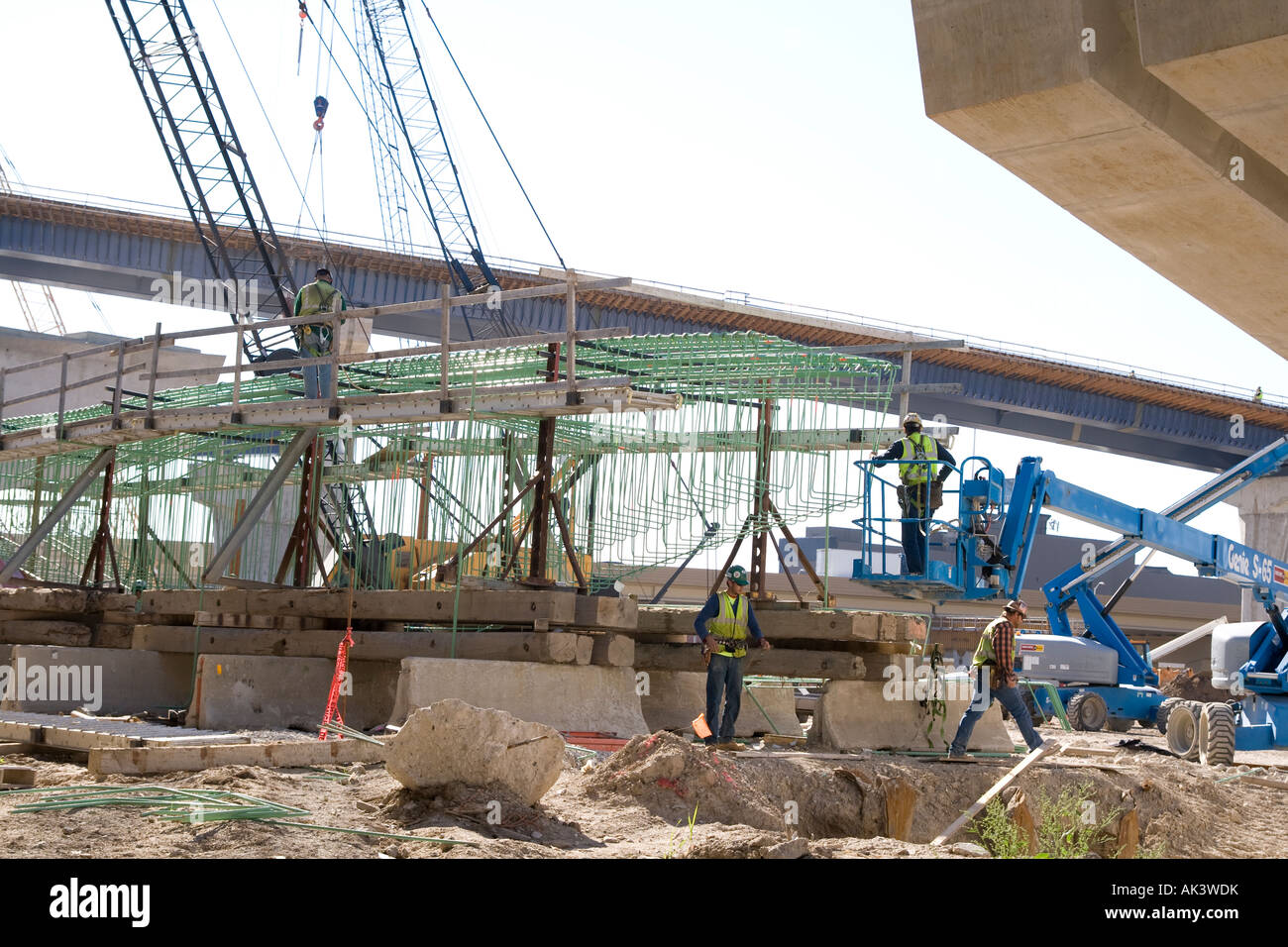 workmen at the site of the Marquette interchange project overpass ...