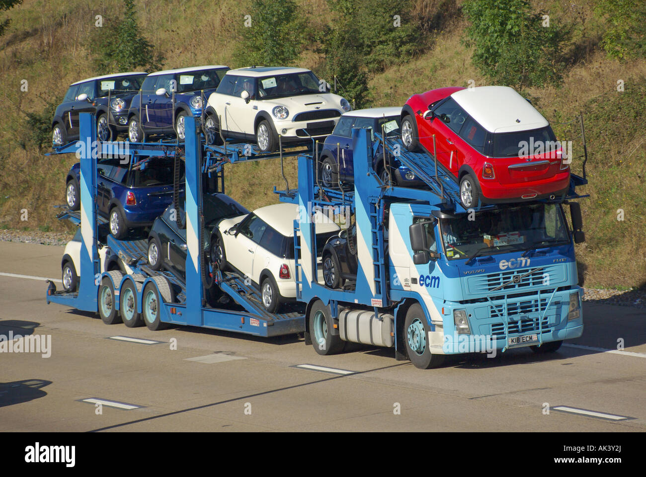 M25 motorway ECM delivery lorry loaded with new BMW Mini cars some with ...