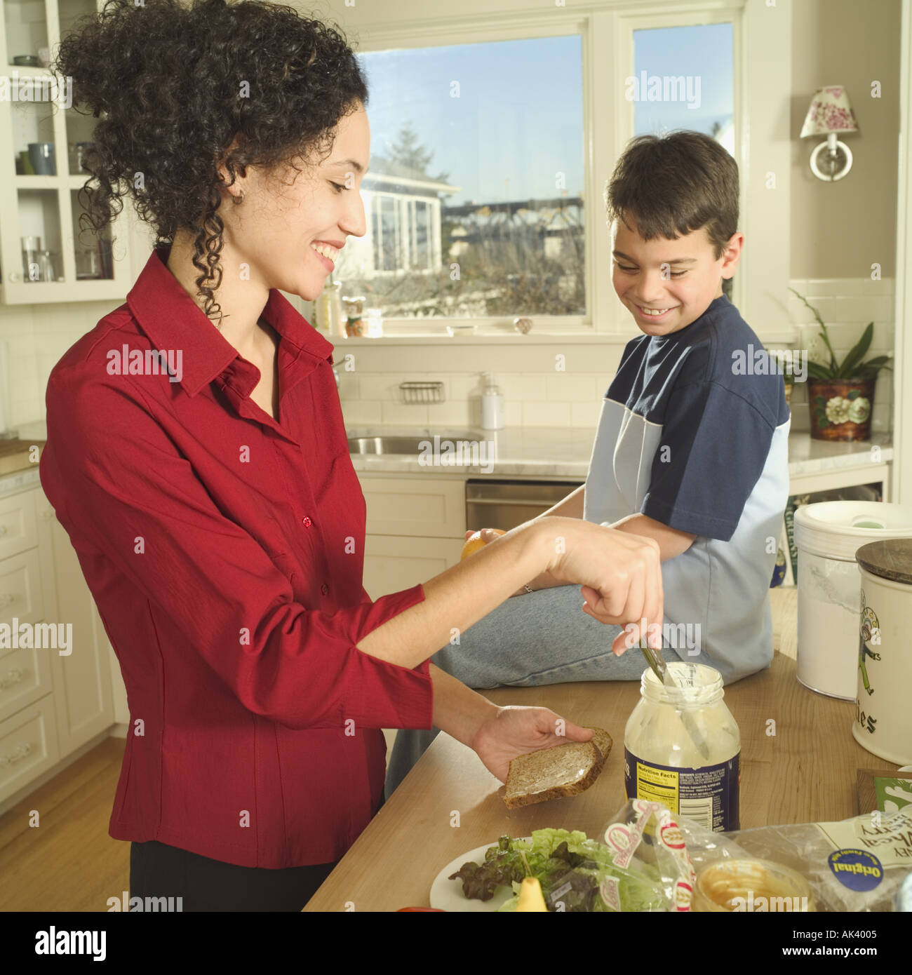 Mother and son preparing lunch together Stock Photo - Alamy